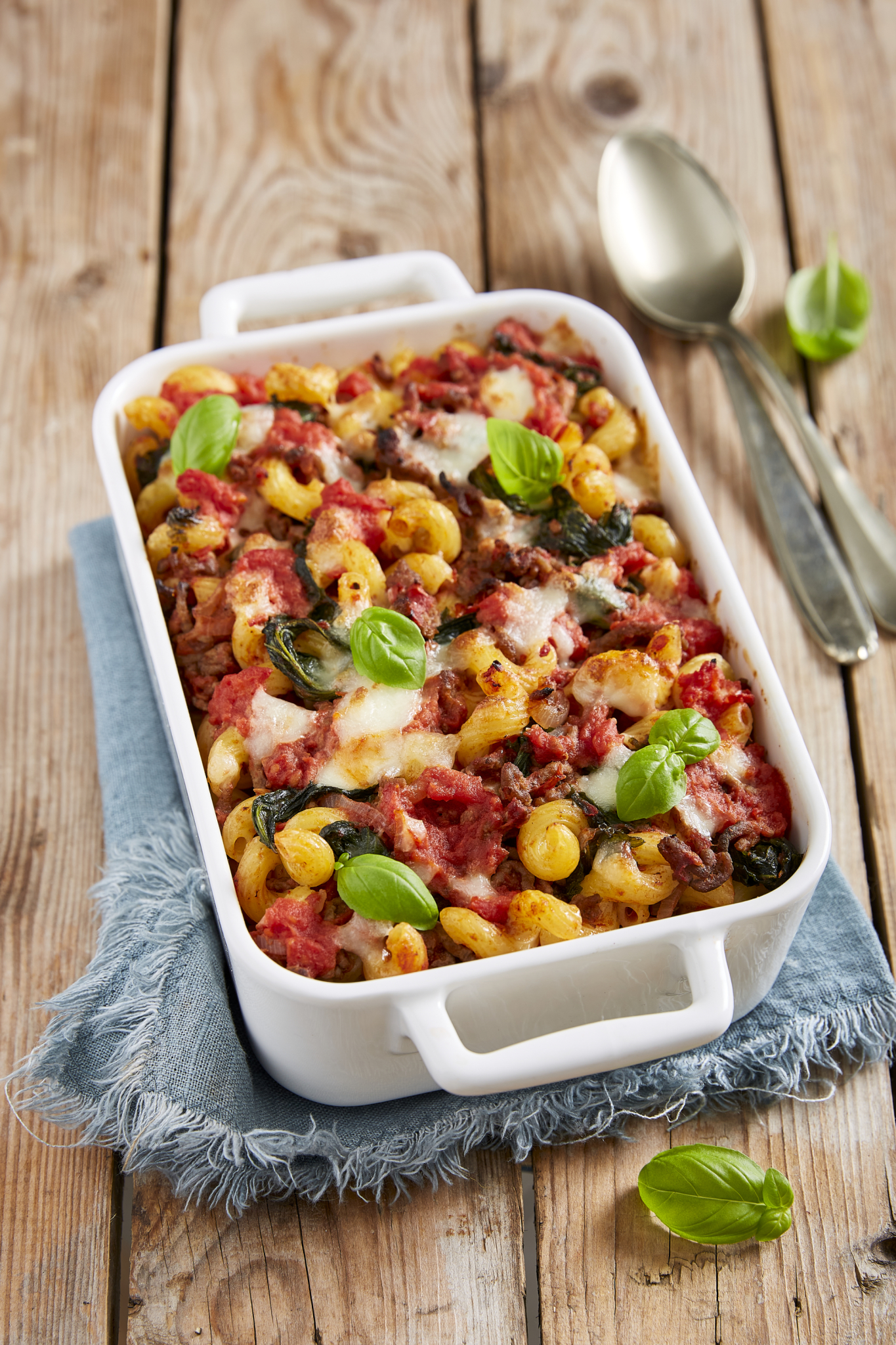 Macaroni casserole with minced meat, kale, mozzarella, polpa, basil ...